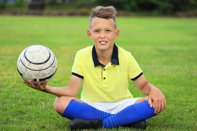 Boy Soccer Player Sitting on the Soccer Field Stock Image - Image of ...