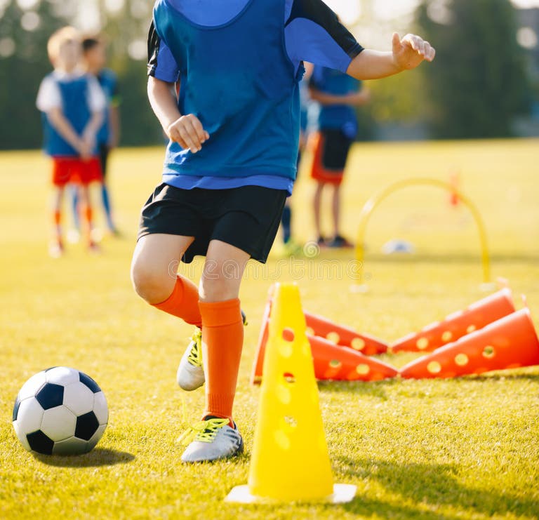 Boy Soccer Player in Training Drill. Young Soccer Players at Practice ...