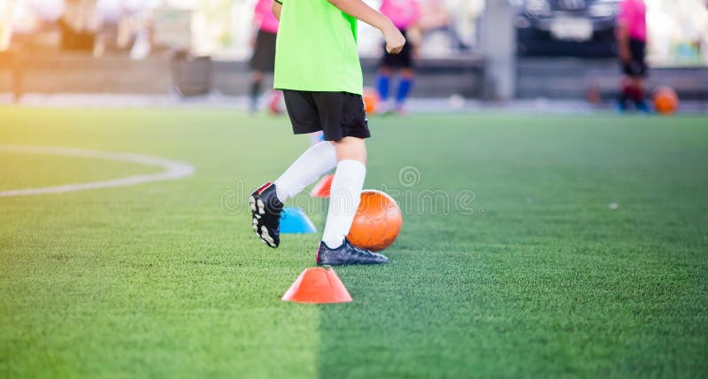 Boy Soccer Player Trap and Control Football between Cone Makers Stock ...