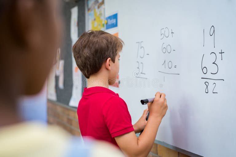 Boy solving math problem stock image. Image of school - 115139391