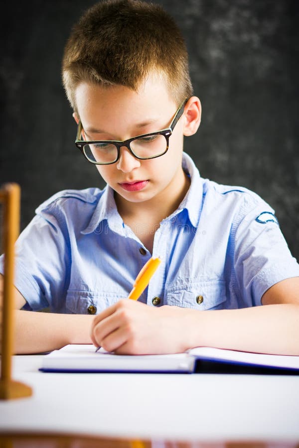 Boy Solving Math Problems at Home Stock Photo - Image of child, pencil ...