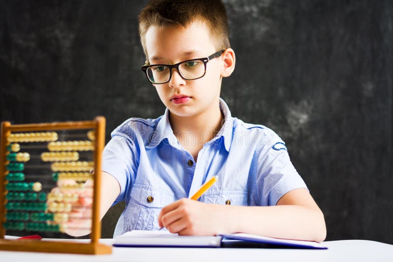 Boy Solving Math Problems at Home Stock Image - Image of alone, cute ...