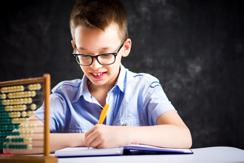 Boy Solving Math Problems at Home Stock Photo - Image of happy, desk ...