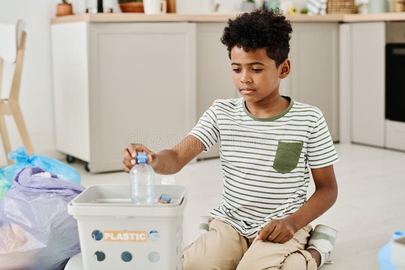 Boy Sorting Plastic Bottles in Containers Stock Image - Image of ...