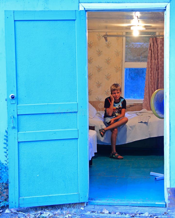 Boy is Speaking Phone Inside Home with Open Door Stock Image - Image of ...