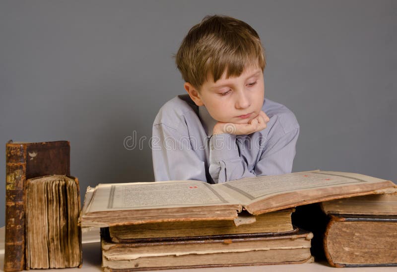The Boy Spends Time Reading Old Books Stock Image - Image of reading ...
