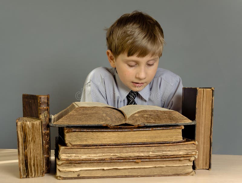 The Boy Spends Time Reading Old Books Stock Photo - Image of clever ...