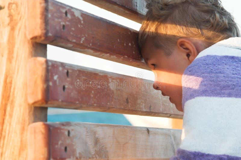 The boy spies on a beach stock photo. Image of peeking - 4057124