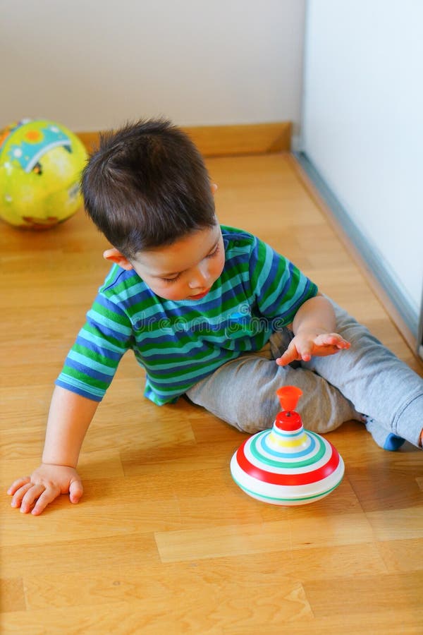 Boy and spin top stock image. Image of play, playing - 67039751