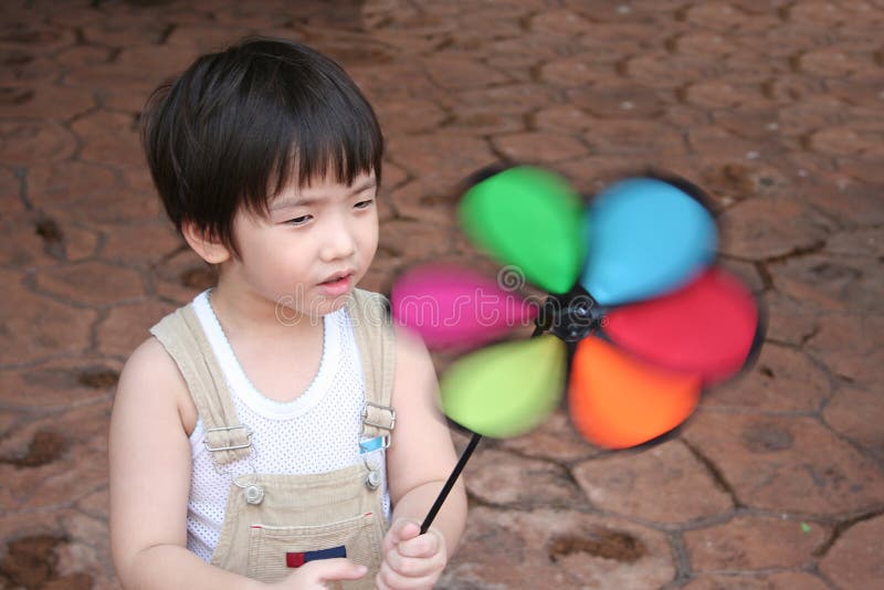 Boy & Spinning Windmill Stock Image - Image of chinese, development ...