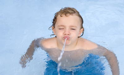 Boy Spitting Water stock photo. Image of spray, youth - 9011818