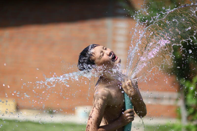 Boy with Splash Water in Hot Summer Day Outdoors Stock Photo - Image of ...