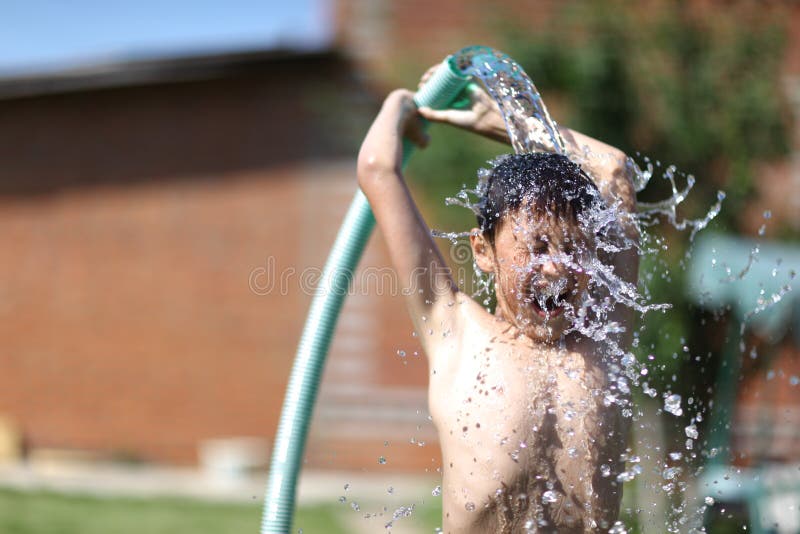Boy with Splash Water in Very Hot Summer Day Outdoors Stock Photo ...