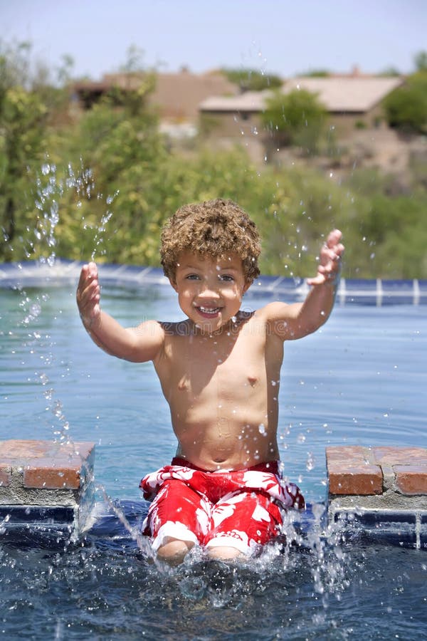 Boy Splashing in a Pool stock image. Image of swmming - 9184701