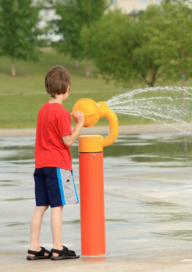 Boy Spraying stock image. Image of solitary, looking, enjoyment - 5790357