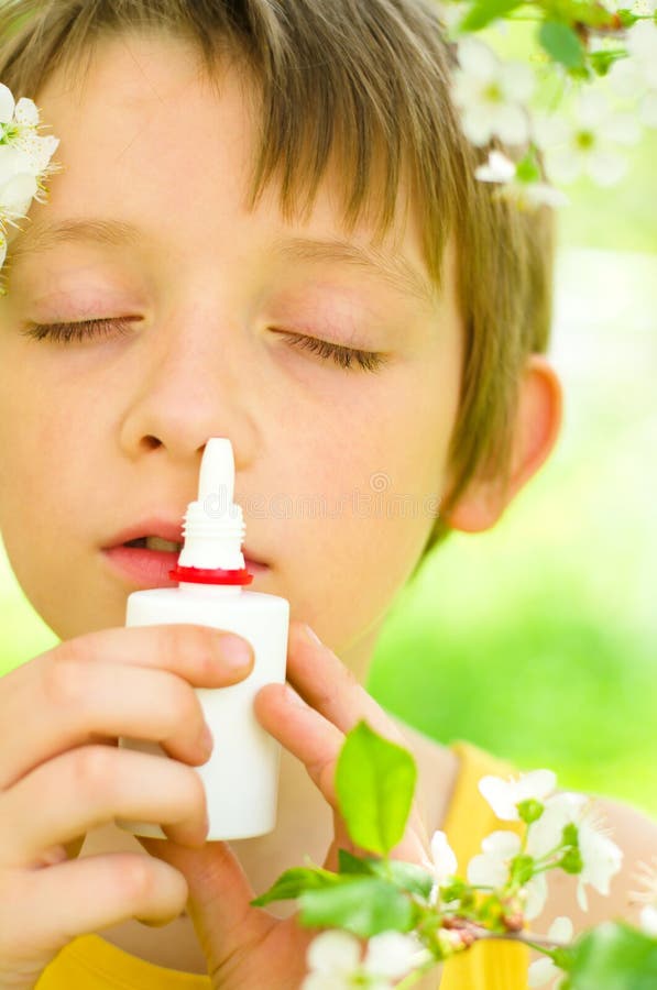 Boy spraying his nose stock image. Image of care, male - 31285783