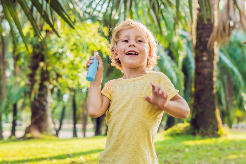 Boy Spraying Insect Repellents on Skin Stock Photo - Image of person ...