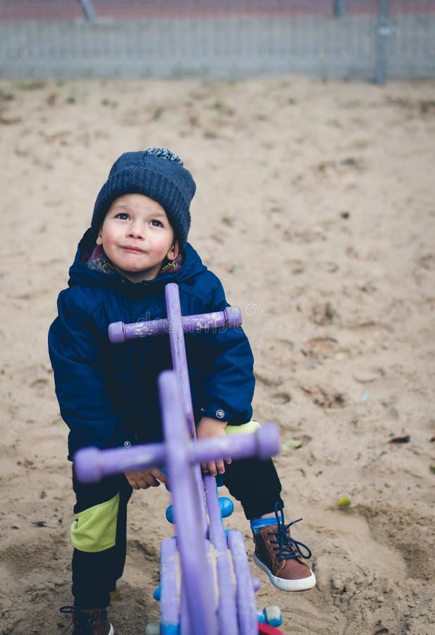 Boy on spring swing stock photo. Image of years, person - 79057676