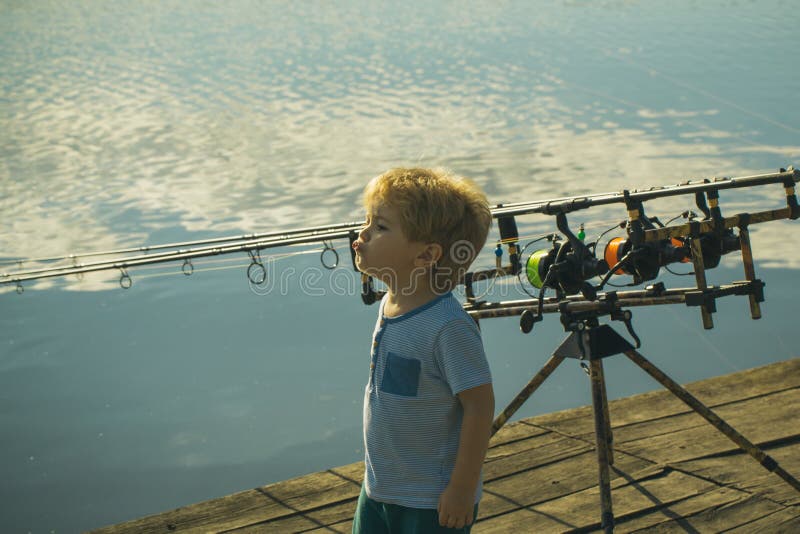 Boy stand on fishing pier stock image. Image of river - 156944033