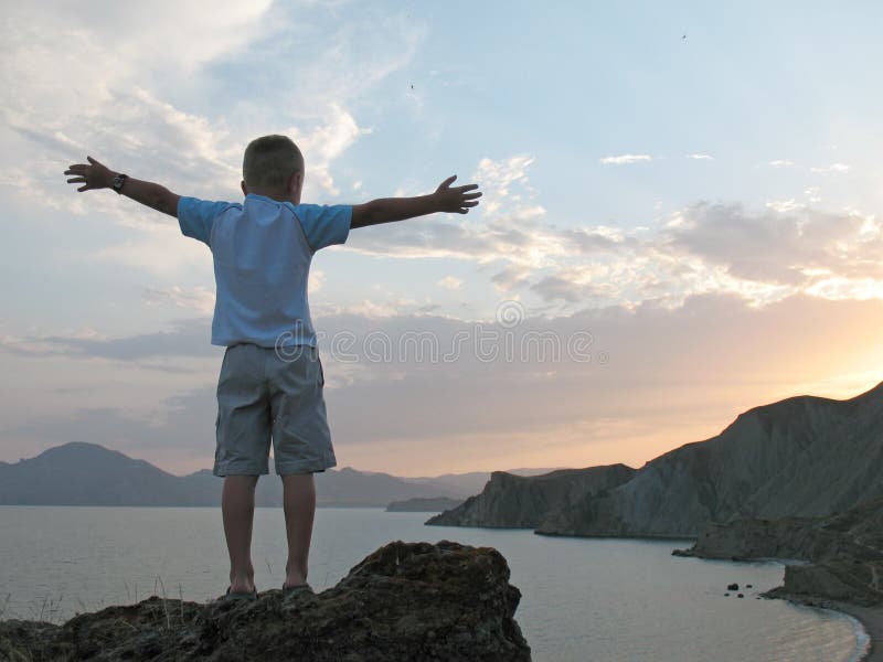 Boy Stand on Mountain Top with Hands Up Stock Photo - Image of ...