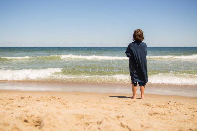 Boy standing on the beach stock image. Image of meditation - 41034209