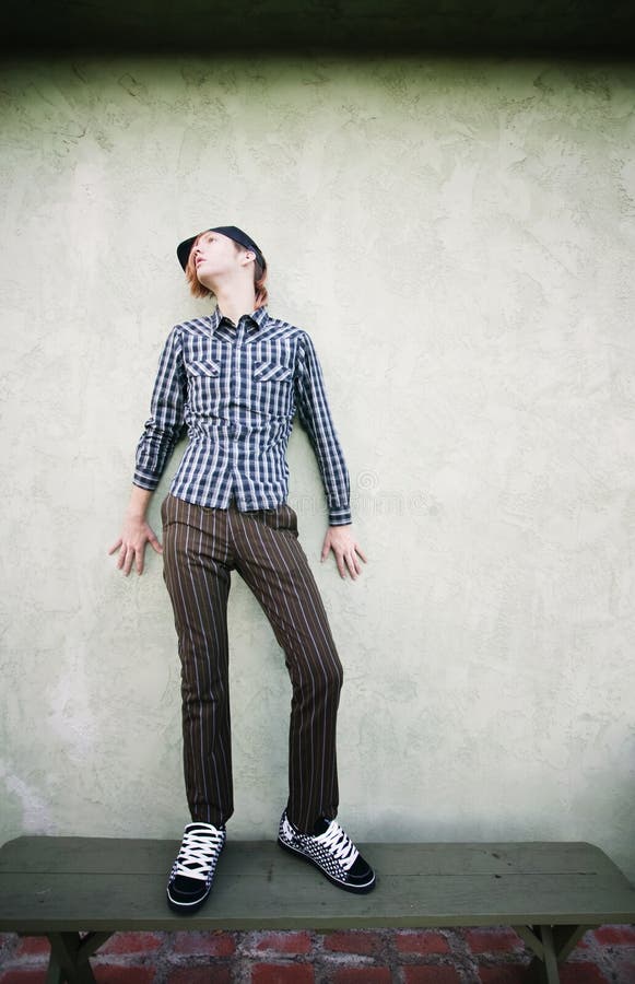 Boy standing on a bench stock photo. Image of brick, eyes - 3911950