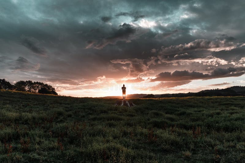 Boy Standing on a Big Log in the Field Under the Storm Stock Image ...