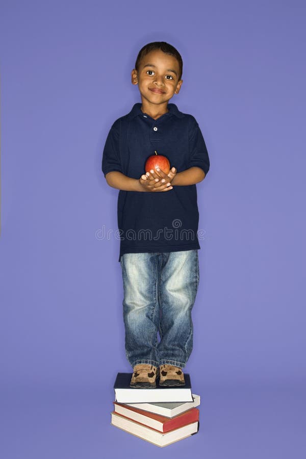 Boy standing on books. stock photo. Image of studio, american - 2044856