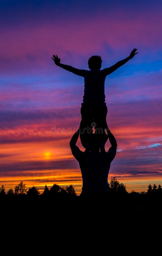 Boy Standing on the Father Shoulders Silhouette with Colorful Sunset ...
