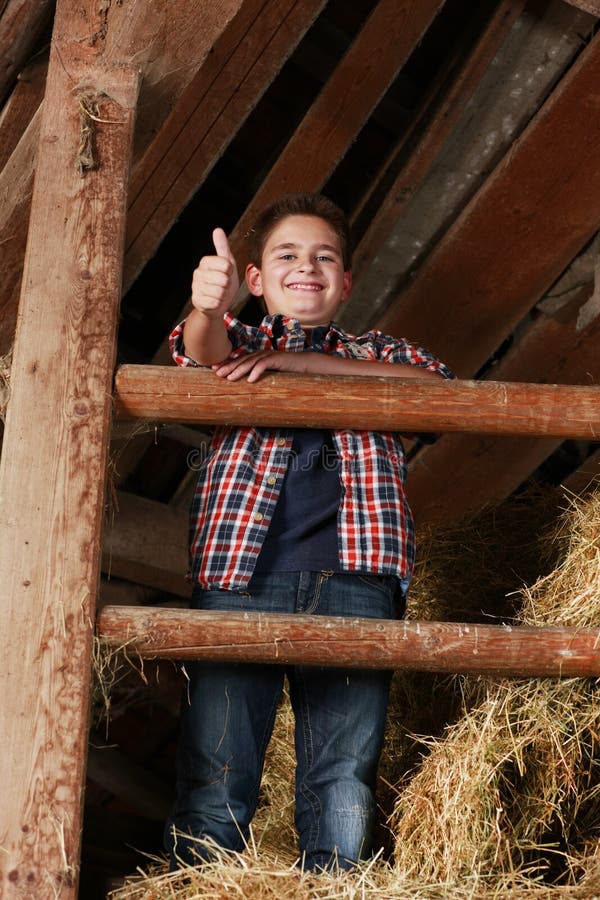 Boy Standing on the Haystack Stock Image - Image of country, teen: 37720531