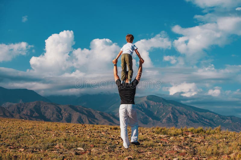 Happy Father and Son Standing on Mountains Background Stock Photo ...