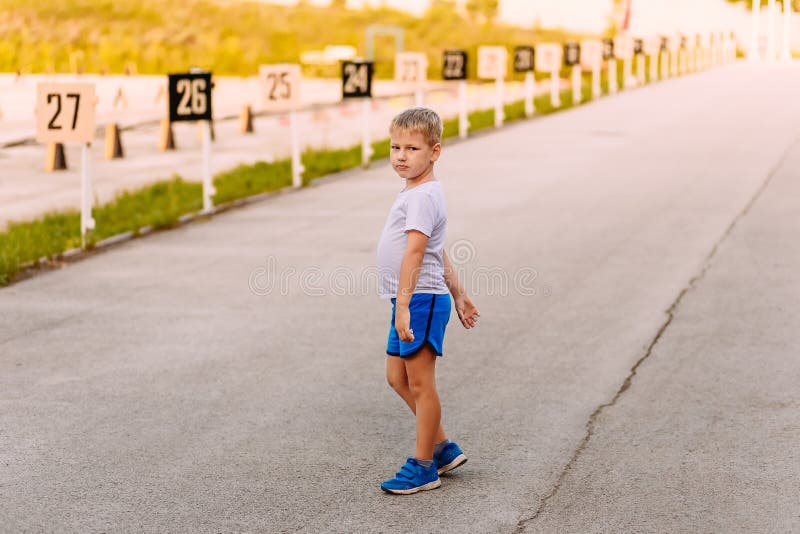 Boy Standing on the Pavement Stock Photo - Image of game, blue: 147268772