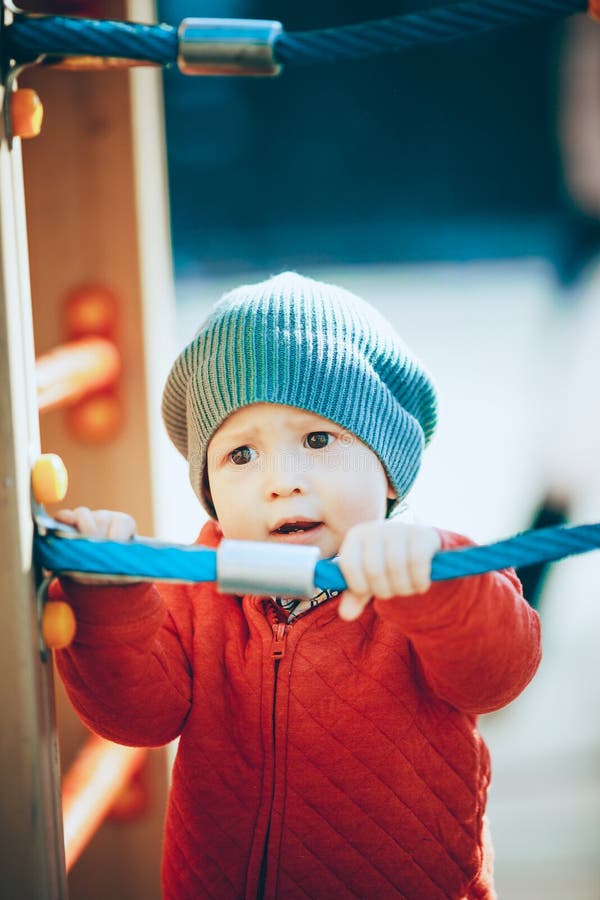 A Boy Stands on the Playground Stock Image - Image of constructions ...