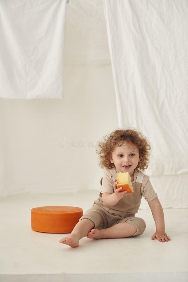 Curly Boy with a Piece of Cheese Stock Image - Image of inside, little ...