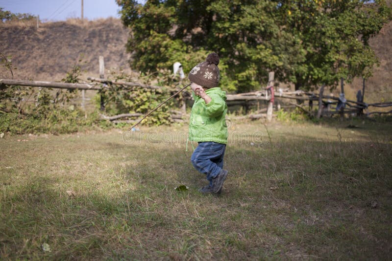 A boy with a stick. stock image. Image of child, forest - 60217073