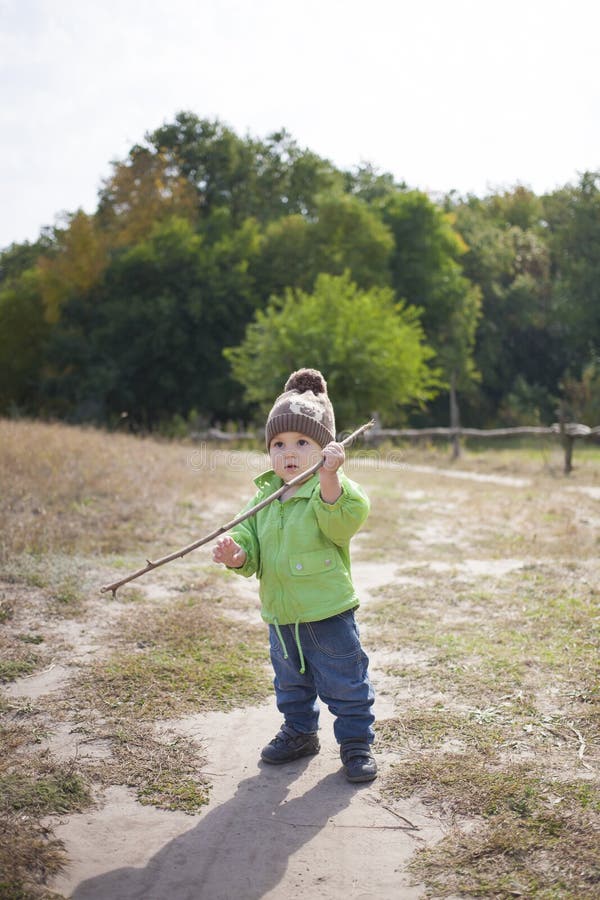A boy with a stick. stock image. Image of outdoors, little - 60305739