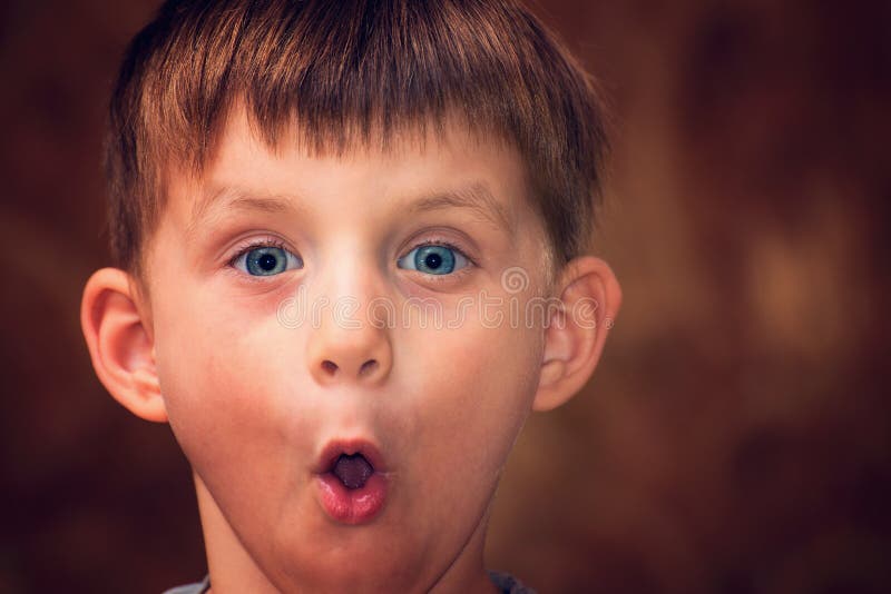 A Boy Strongly Emotional Shows a Different Face To the Camera Stock ...