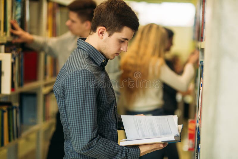 Boy Student in Library Want To Find Some Book. Student Getting Ready To ...