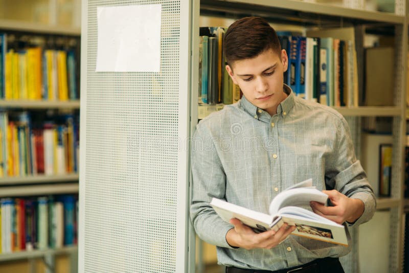 Boy Student in Library Want To Find Some Book. he Read the Book ...