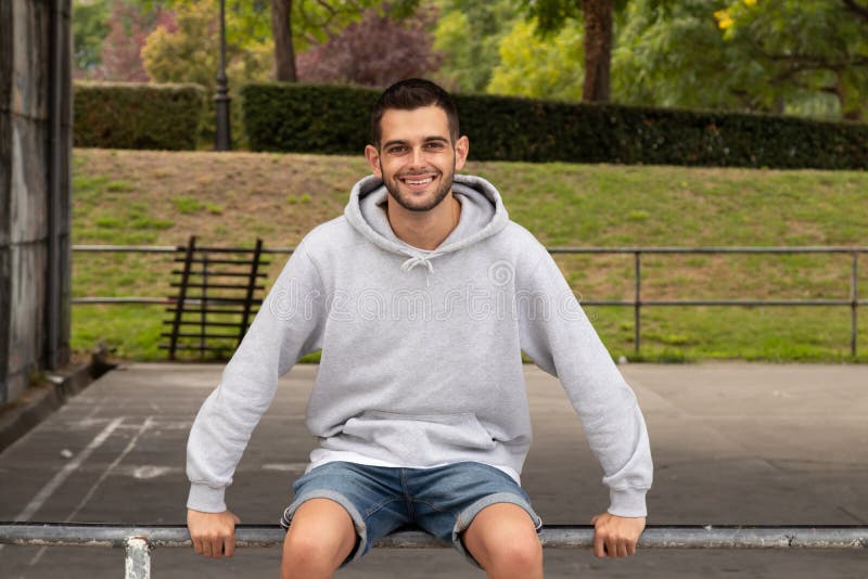 Boy or Student Sitting on City Street Stock Photo - Image of outdoors ...