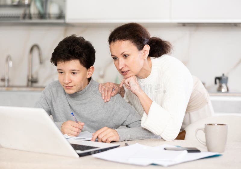 Boy Studiyng, Mother Helping Stock Image - Image of german, adult ...