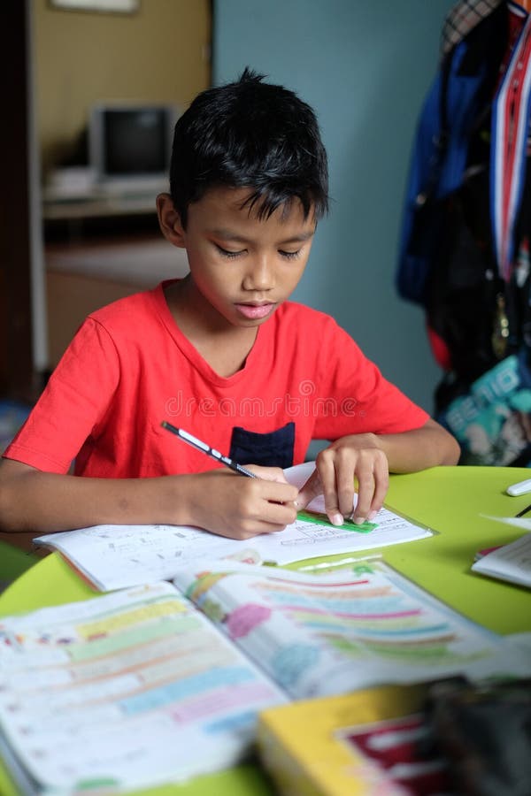 A boy study at his bedroom stock photo. Image of reading - 117719660