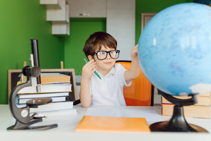 Boy Studying at Home with Notebook and Doing School Homework. Distance ...