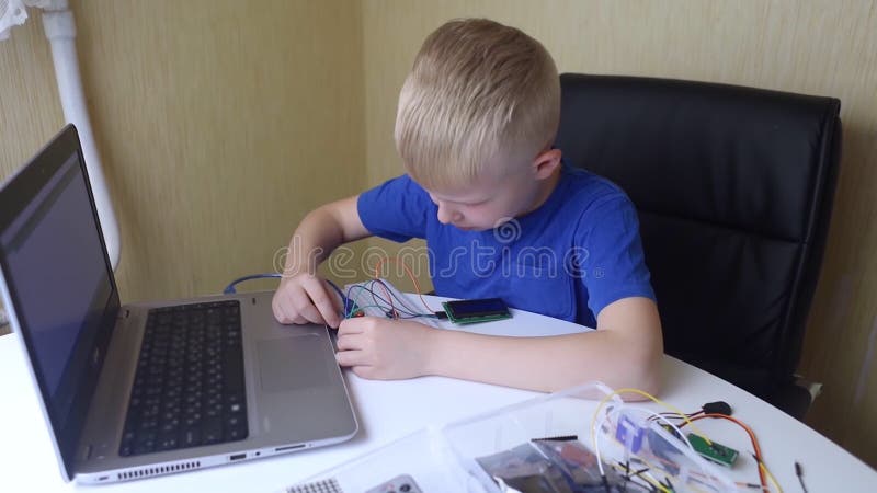 Programming for Children. a Teacher Teaches a Child at a Robotics and ... Programming for Children. a Teacher Teaches a Child at a Robotics and ...