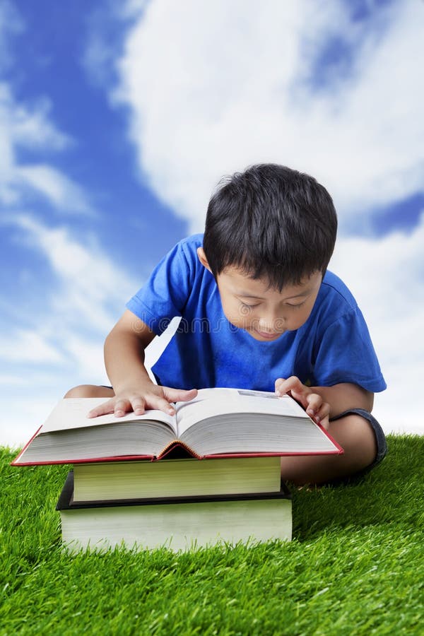 Boy studying outdoor stock image. Image of child, reading - 24925143
