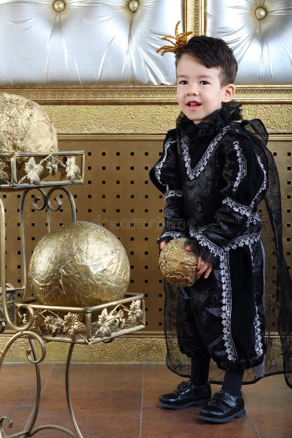 Boy in a Suit of Black Prince Holding Ball Stock Image - Image of ...