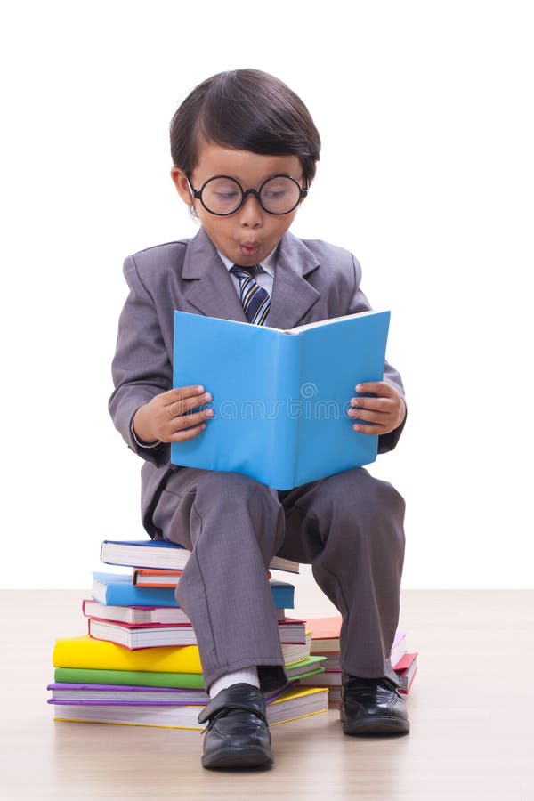 Boy in suit reading a book stock image. Image of little - 41492949