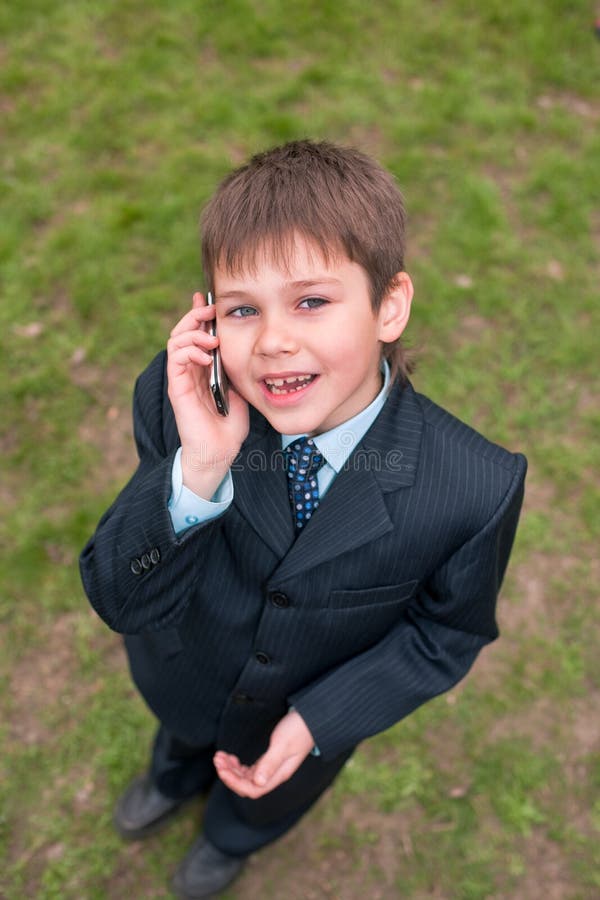 Boy in Suit Speaking Over the Mobile Stock Image - Image of cute, green ...