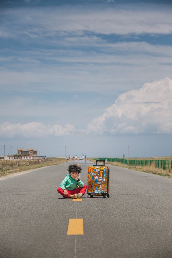 Boy with Suitcase Sitting on the Ground Thinking Stock Image - Image of ...