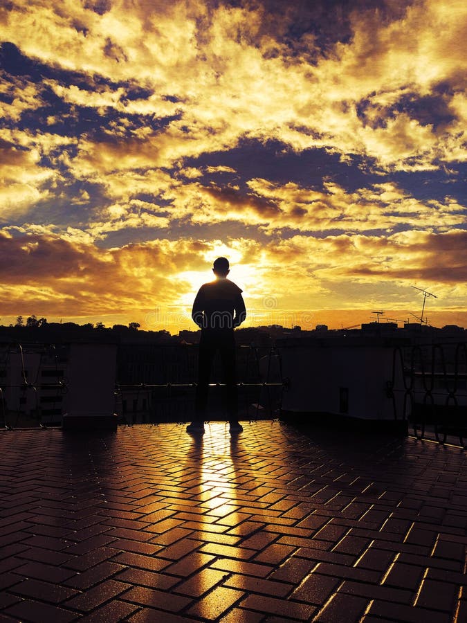 Boy at sunset stock photo. Image of view, sunset - 238571484